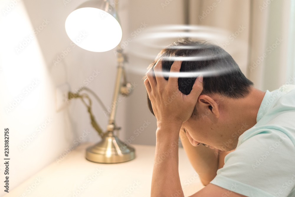 Vertigo illness concept. Man hands on his head felling headache dizzy ...