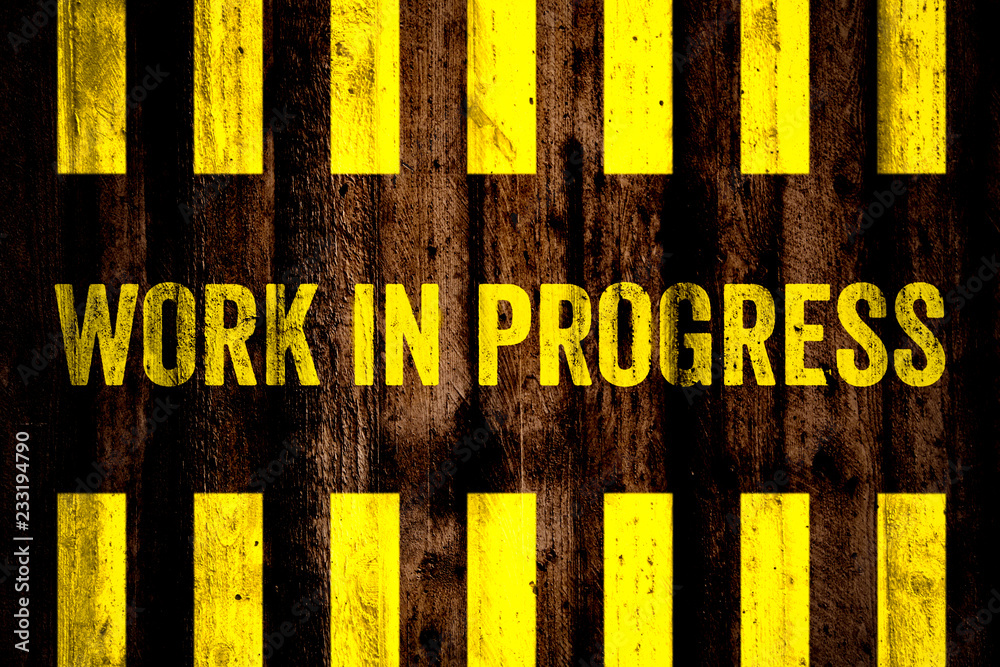 Foto de Work in progress warning sign with yellow and black stripes ...