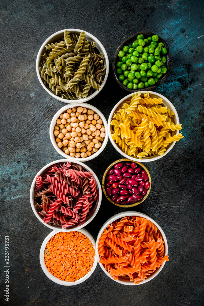 Trend healthy food, vegan diet concept. Multi colored legume pasta with ...