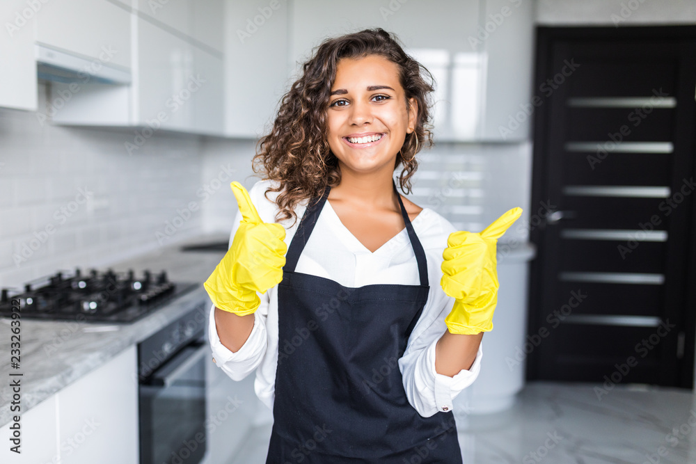 Cleaning company concept. Portrait of beautiful positive young woman ...