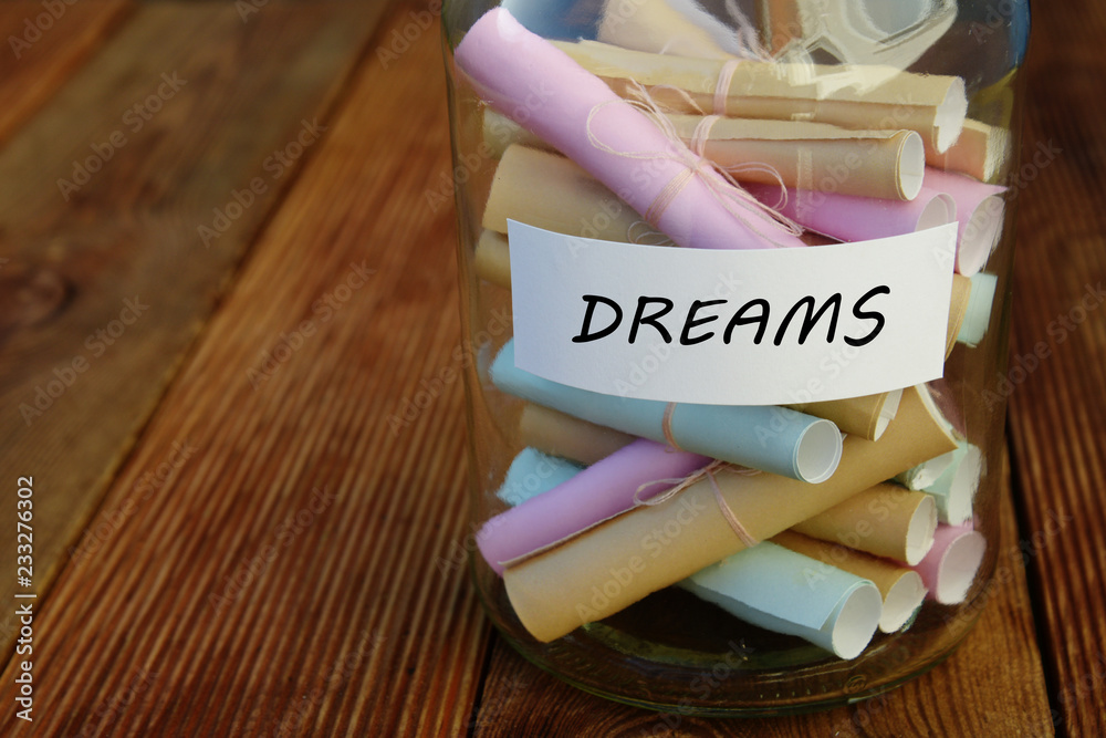 Jar with the word Dreams written on paper and attached on it. A jar ...