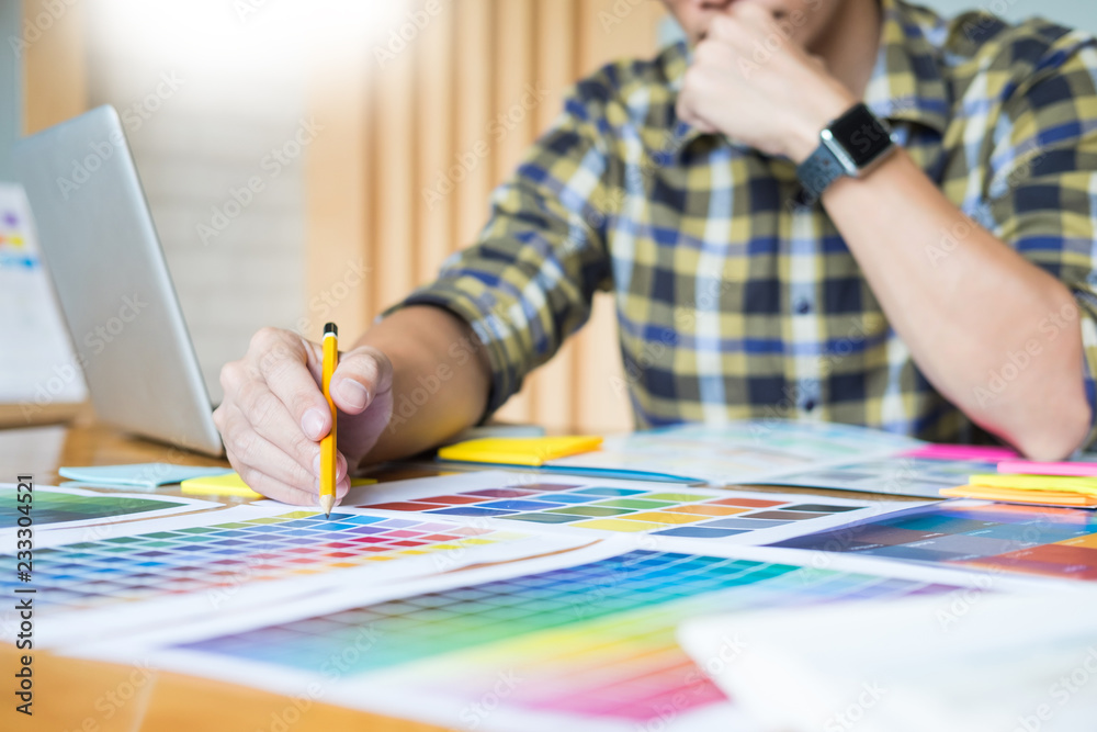 Creative Graphic designer at work. Color swatch samples pantone palette ...