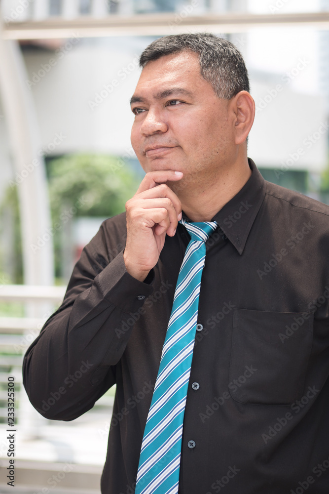 thoughtful old man thinking, senior man planning with idea; portrait of ...