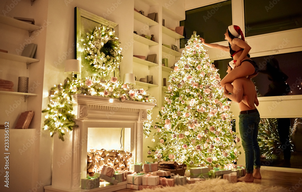 Sexy couple celebrating Christmas Stock Photo | Adobe Stock