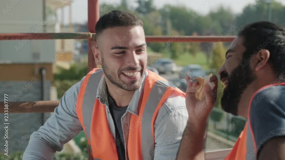 People working in construction site. Men at work in new house inside ...