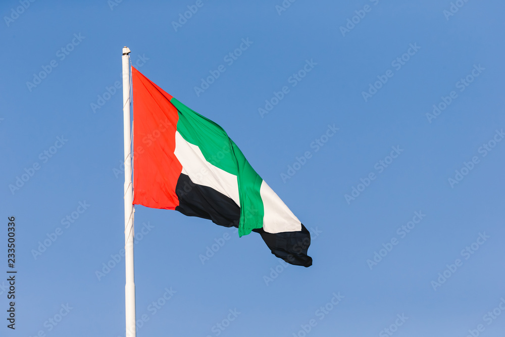 UAE flag waving in the sky, national symbol of UAE Stock Photo | Adobe ...