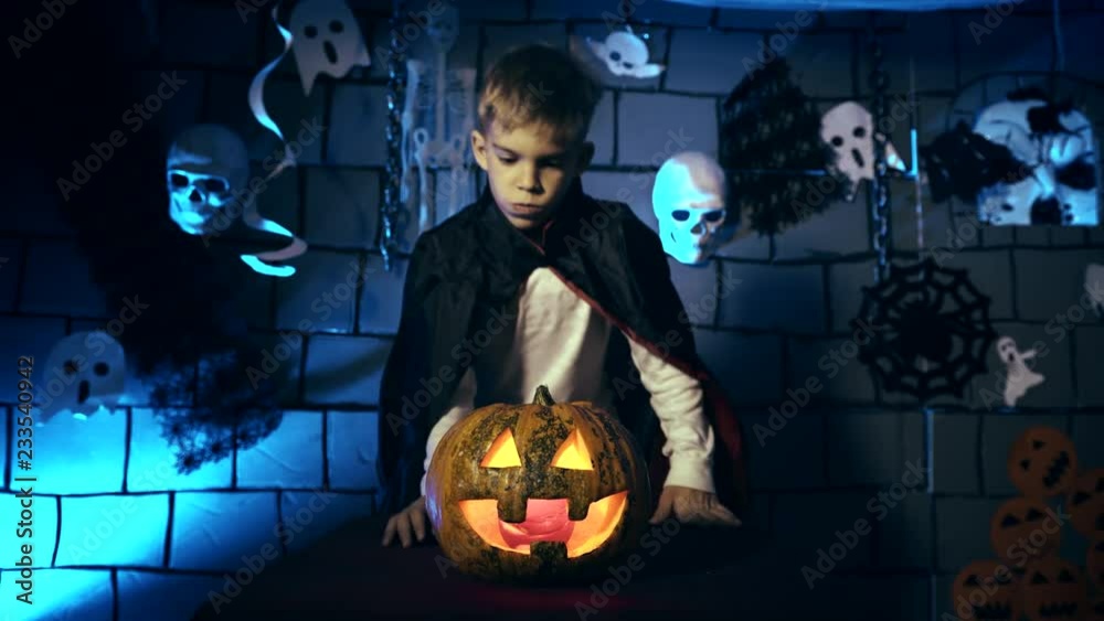 Young boy in a vampire costume for Halloween showing his scary face and ...
