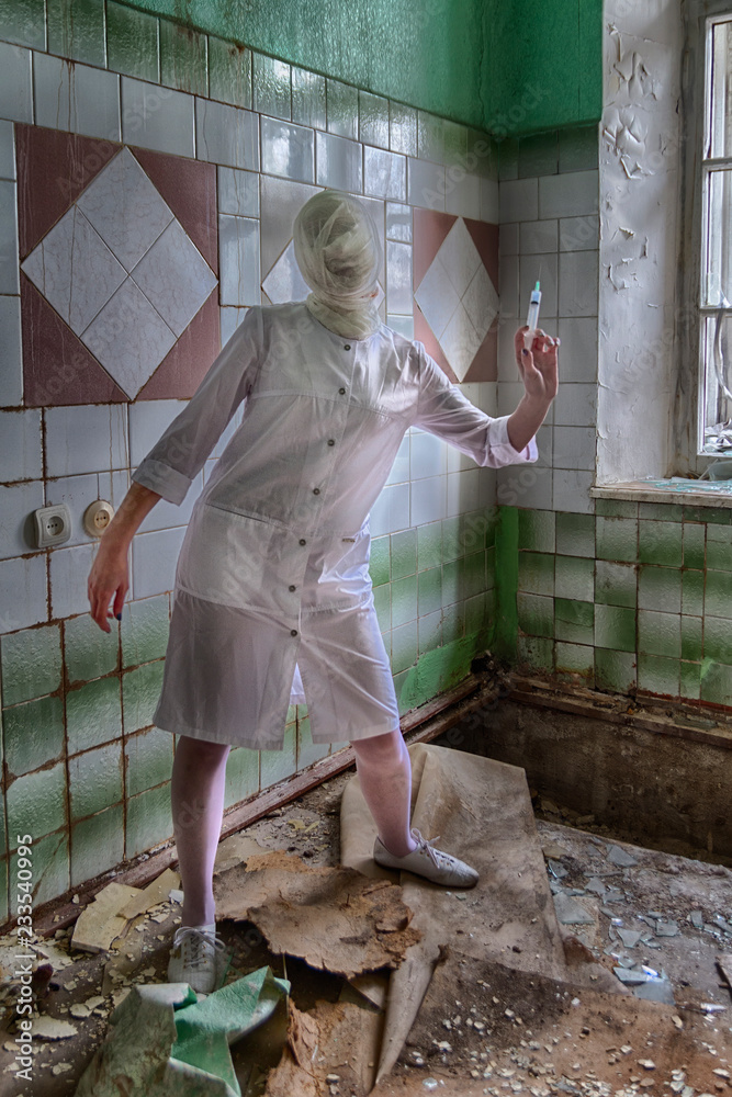 A ghost nurse or a zombie nurse or doctor with a tightly bandaged head ...