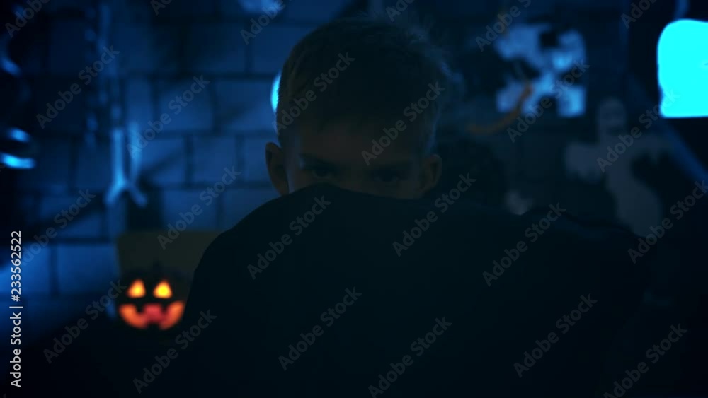 Young boy in a vampire costume for Halloween showing his scary face and ...