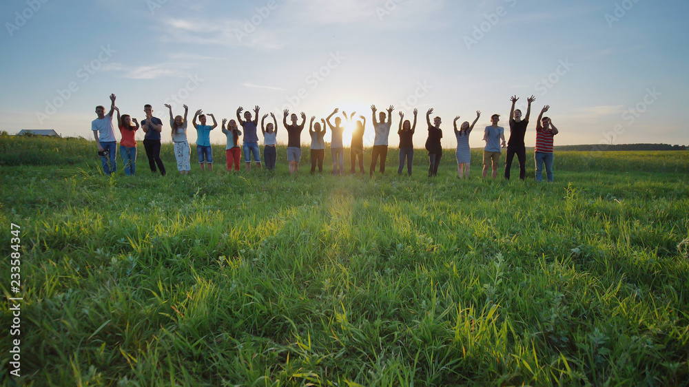 Students say goodbye to the school. Pupils waving their hands against ...