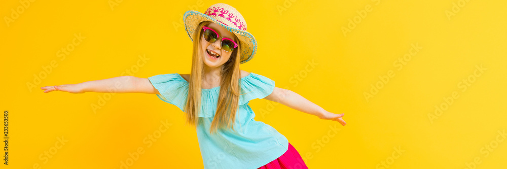 Girl with red hair on a yellow background. A charming girl in bright ...