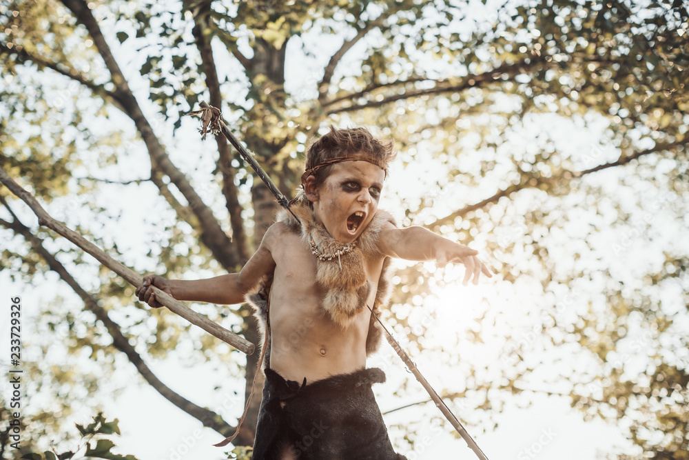 Caveman, manly boy with weapon aggressively shouting. Dramatic action ...