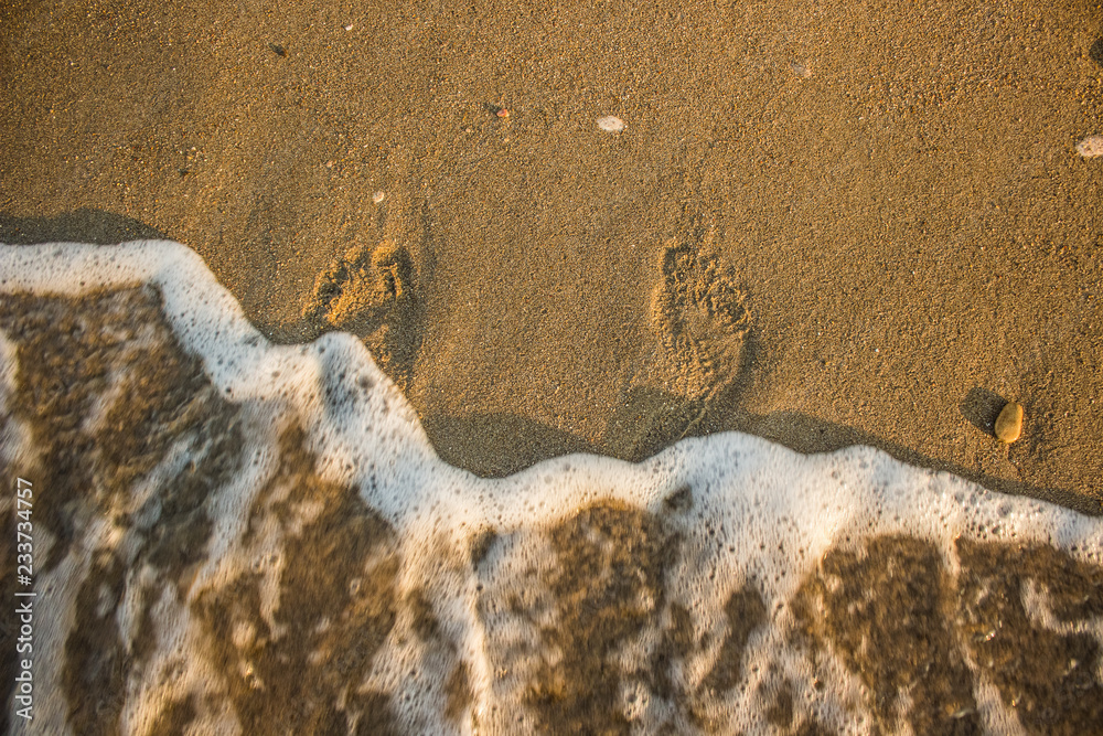 human footprints on sea sand shore waterfront district background ...