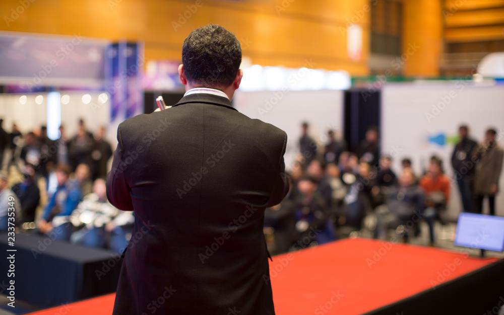 Fotografia do Stock: Presenter Presenting on Stage at Conference ...