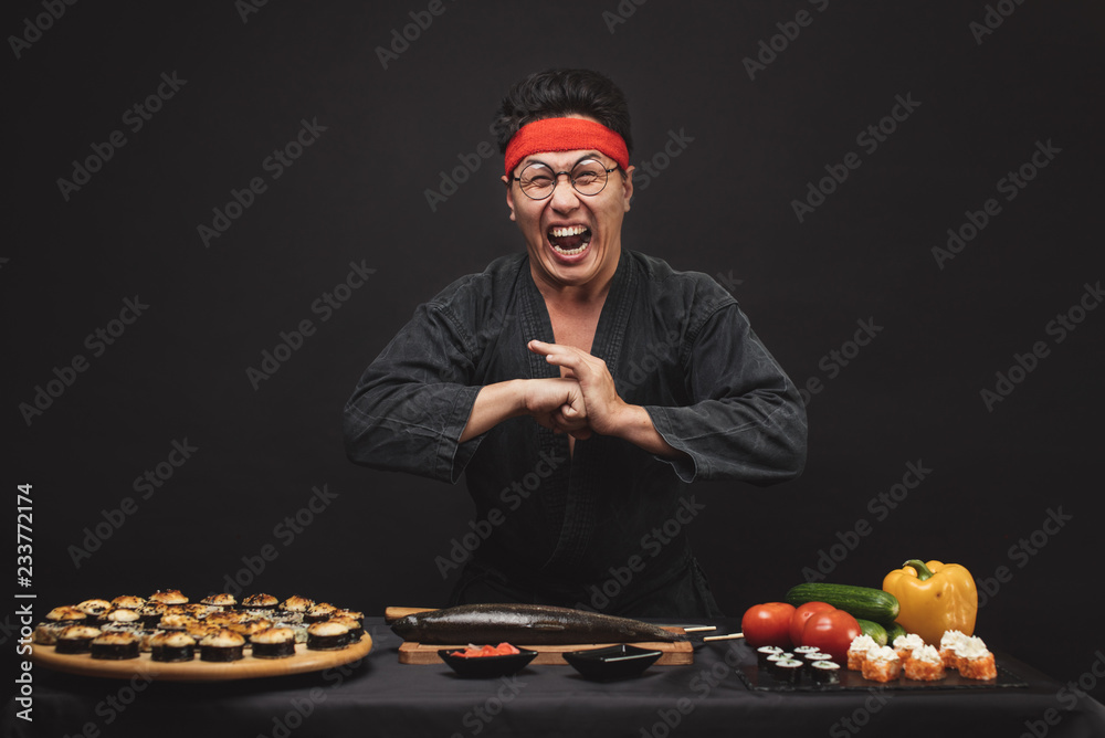 kung fu training while cooking. crazy mad man with funny grimace. close ...