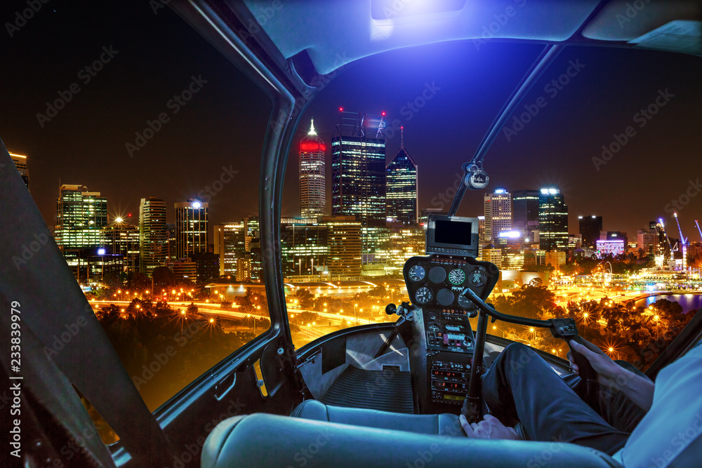 Helicopter cockpit interior flying on Central business district ...