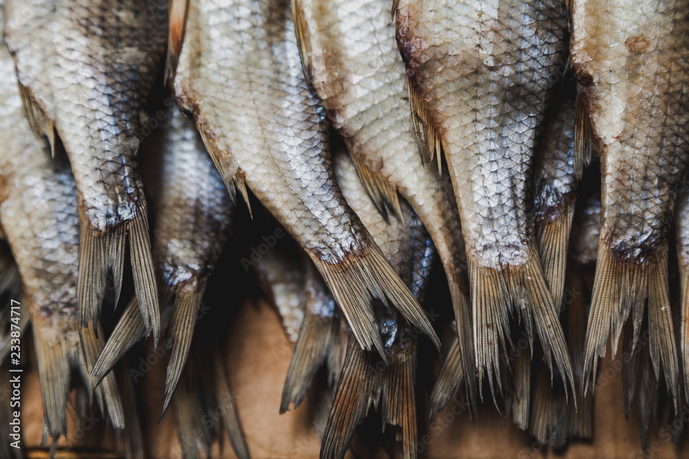 Tail of dried fish lie on counter Stock Photo | Adobe Stock