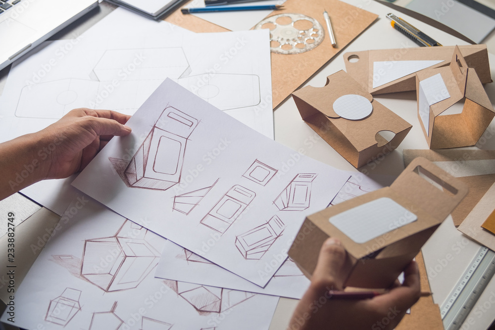 Designer sketching drawing design Brown craft cardboard paper product ...