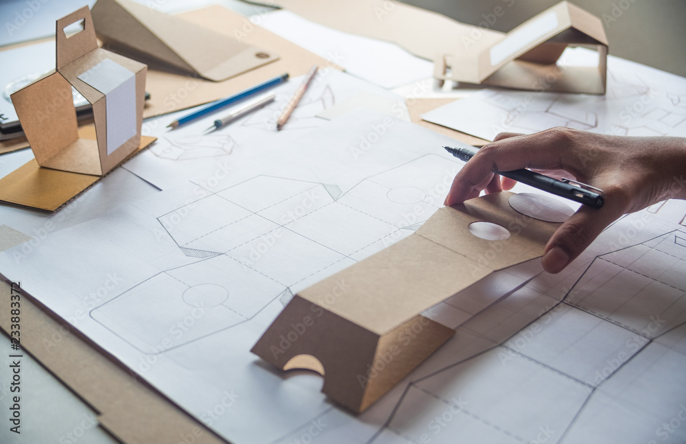Designer sketching drawing design Brown craft cardboard paper product ...