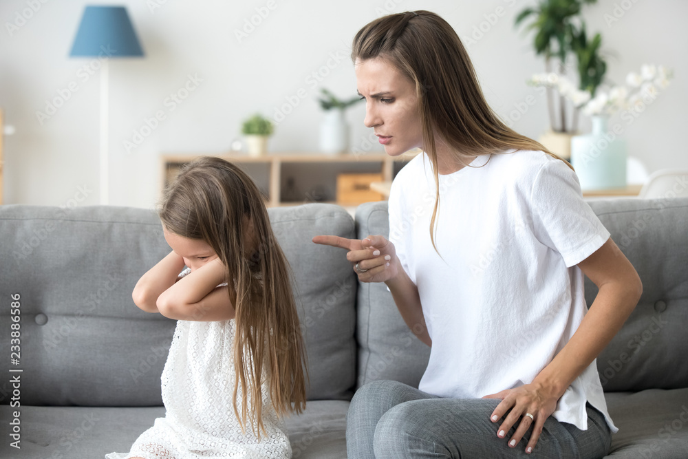 Angry mother scolding lecturing stubborn kid closing ears not listening ...