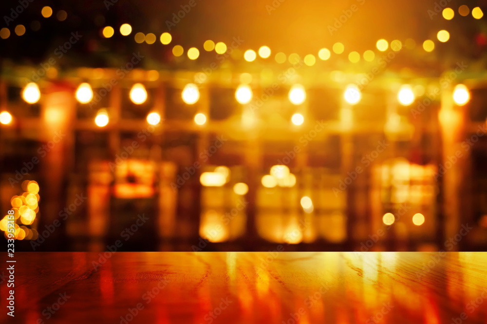 blur light of party in bar and pub at night with top of wood background ...