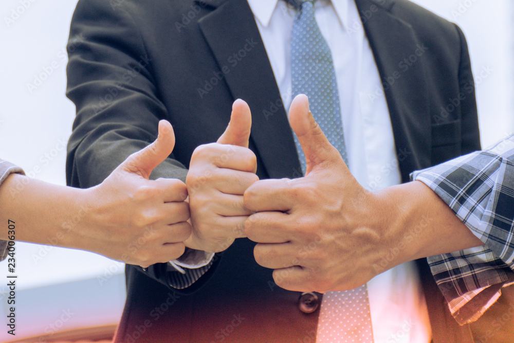 Teamwork of business people raised thumb up, expression you can do it ...