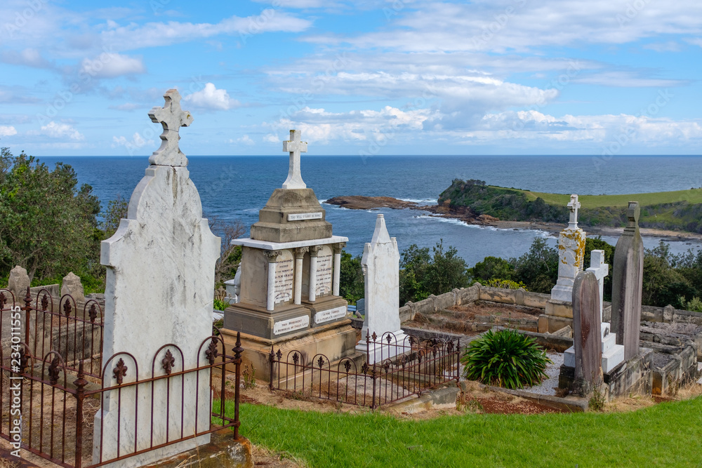 Graves in graveyard, headstones and railing at peaceful historic ...