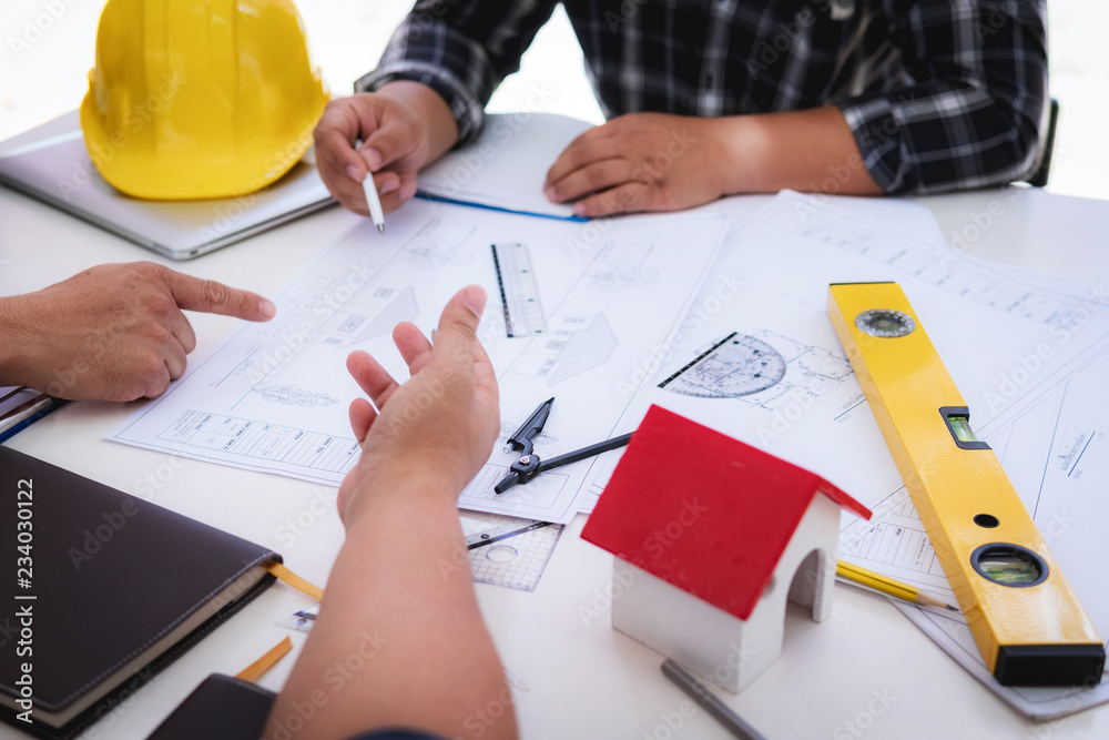 engineer people meeting working and pointing at a drawings in office ...