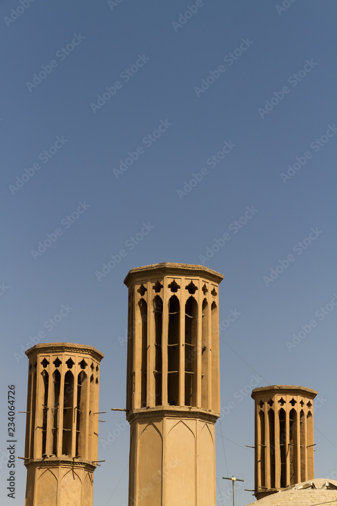 Iconic Badgirs (windtowers) in the mud-brick desert city of Yazd, Iran ...
