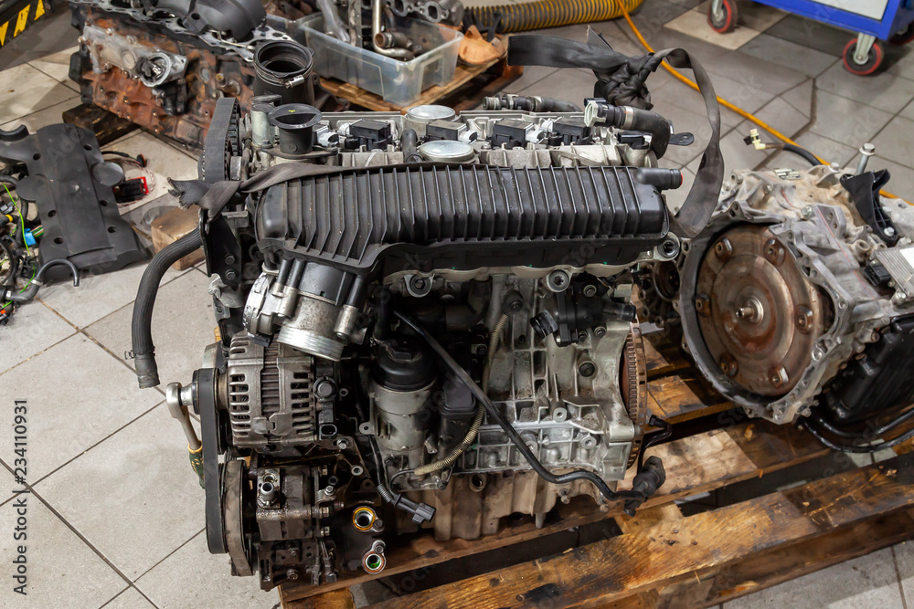 Replacement engine used on a pallet mounted for installation on a car ...