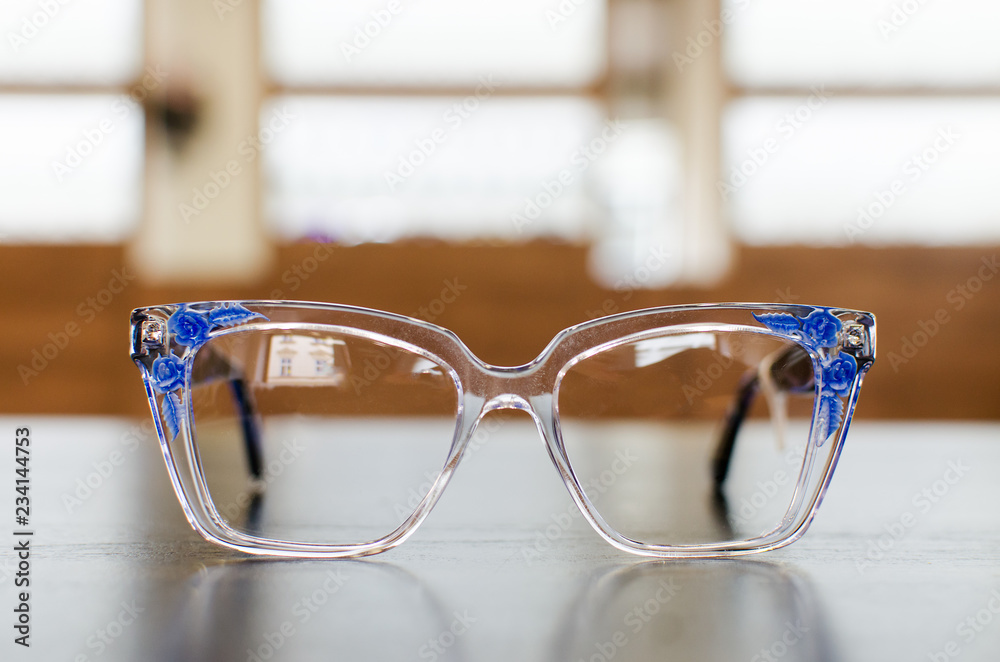 Eccentric eyeglasses with blue flowers Stock Photo | Adobe Stock