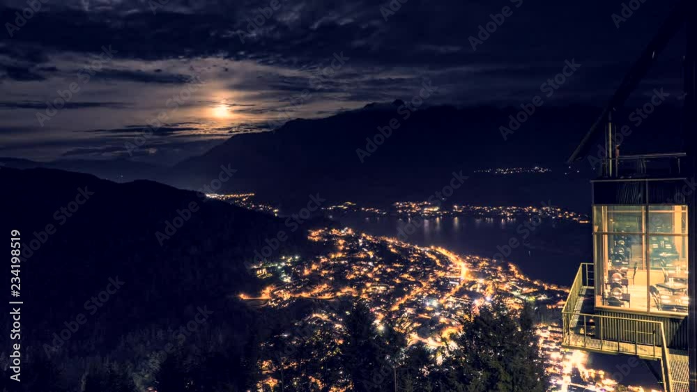 Night timelapse of Queenstown with rising Moon giving beautiful light ...