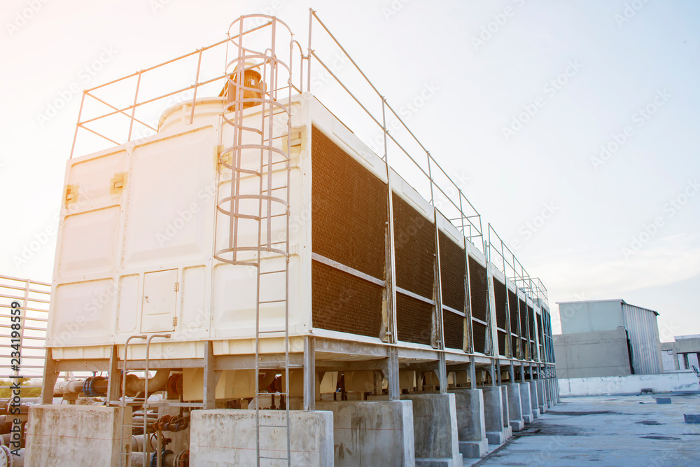 A set of cooling towers in a data center building is installed on the ...