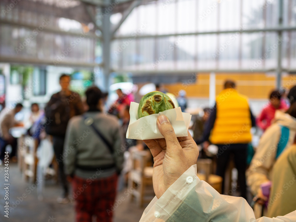 Kusamochi or grass-mochi (rice flour dumplings) with red bean paste ...