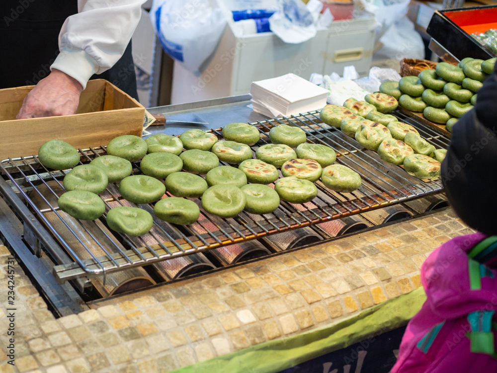Kusamochi or grass-mochi (rice flour dumplings) with red bean paste ...