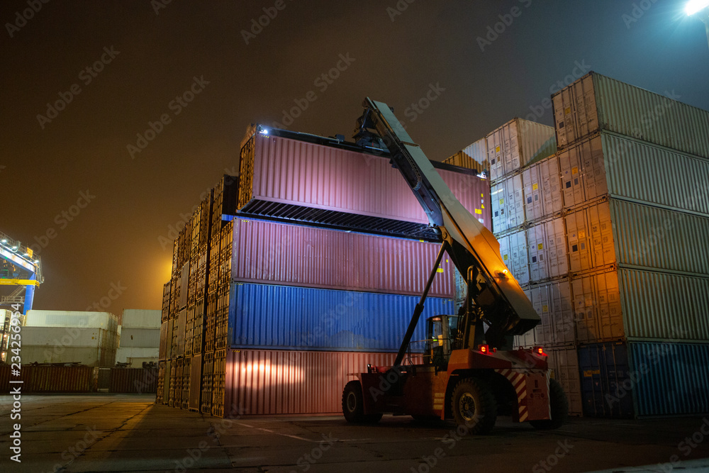 Reach Stacker during operation. Reach-stacker container loader during ...