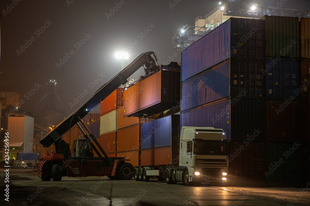 Reach Stacker during operation. Reach-stacker container loader during ...