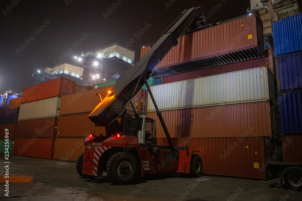 Reach Stacker during operation. Reach-stacker container loader during ...