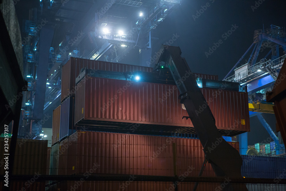 Reach Stacker during operation. Reach-stacker container loader during ...