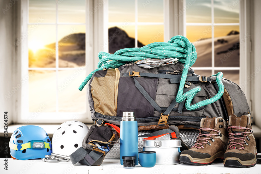 Backpack on wooden table and winter background of white window with ...