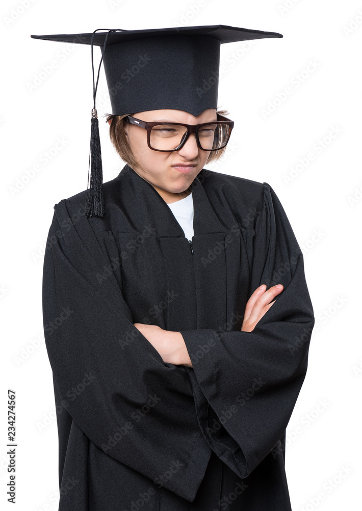 Sad disappointed graduate little girl student in black graduation gown ...