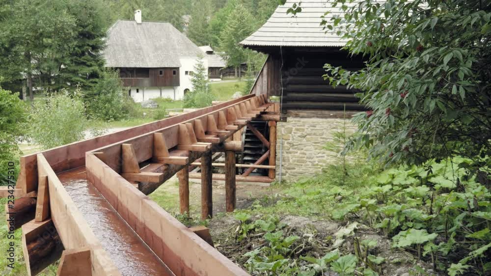 Wooden water turn of miller wheel. Historic medieval village ...