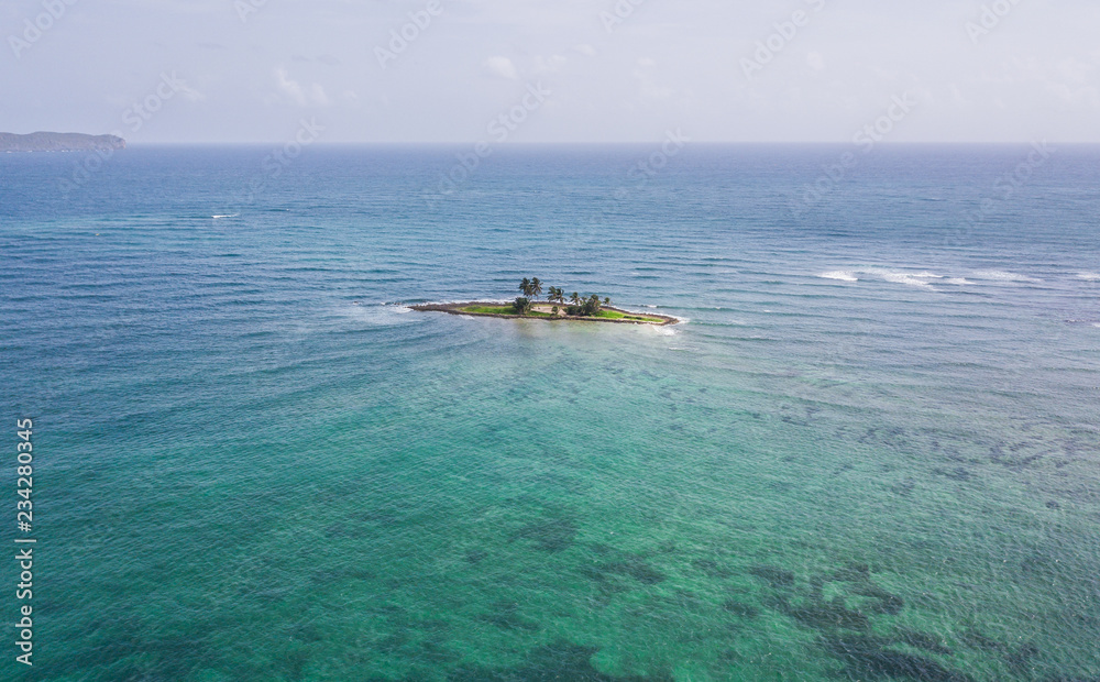 Small desert island in the ocean. Tropical island above top view ...
