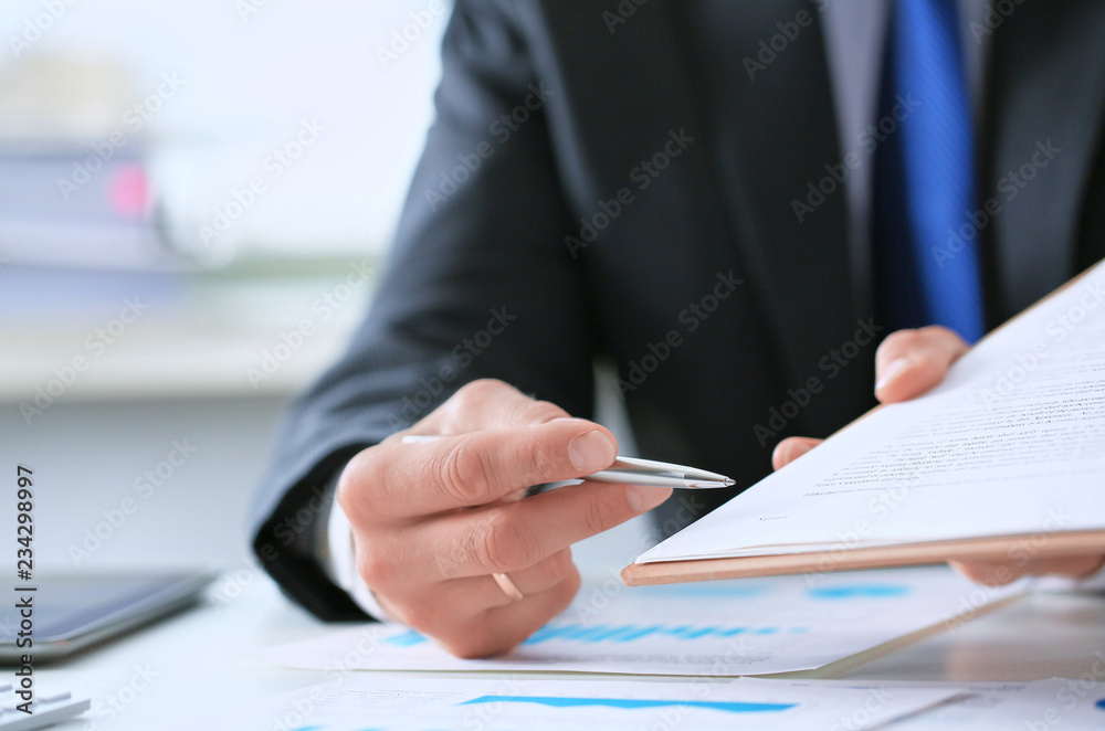 Businessman pointing the place where you have to to put the signature ...