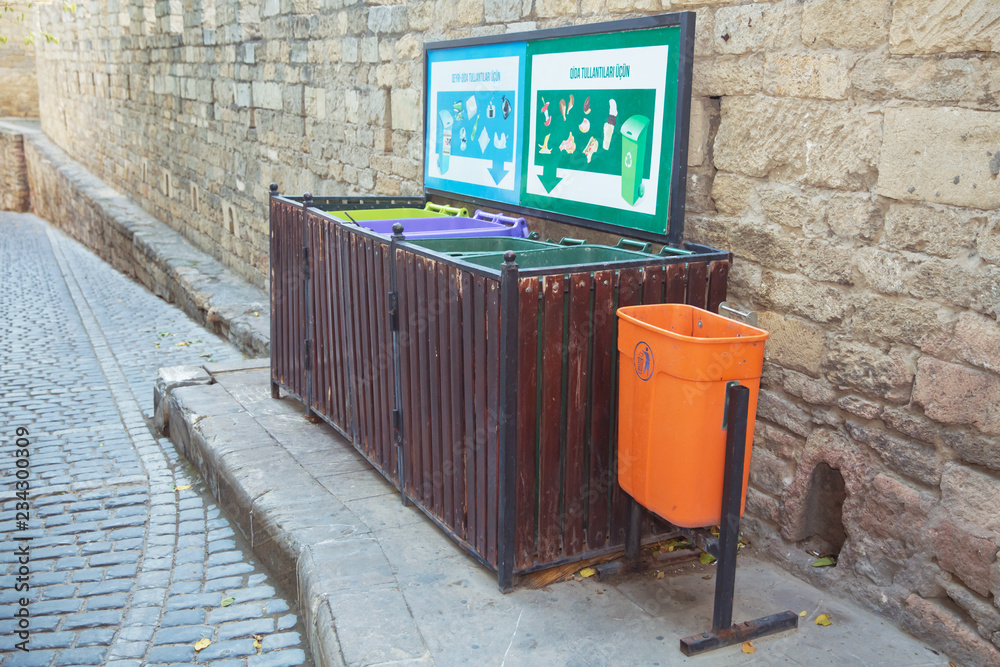 Different recycle bins on stand near footpath . Food waste . non-food ...