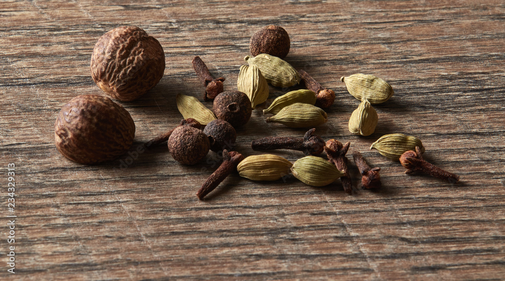 Cardamom, cloves, nutmeg, allspice. Different types of whole Indian ...