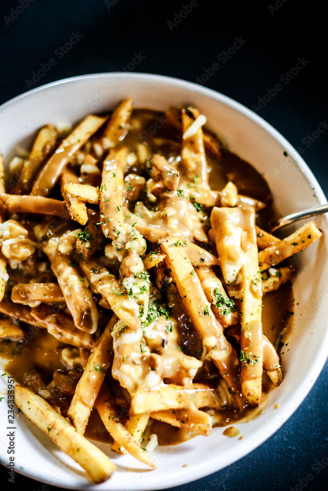 Poutine, french fries with cheese and gravy Stock Photo | Adobe Stock