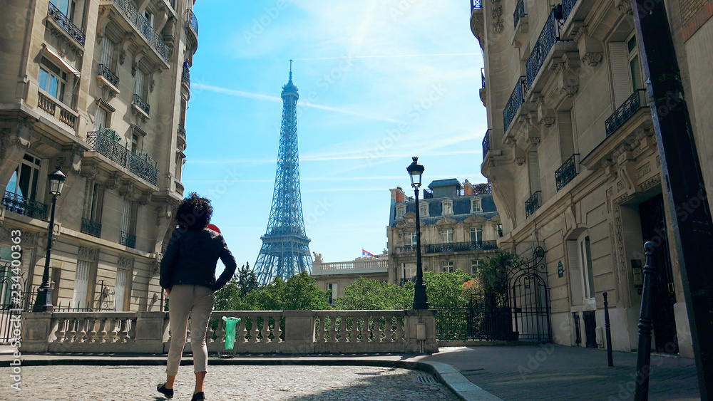 Fashion model woman enjoy view of Eiffel tower walking the Camoens ...