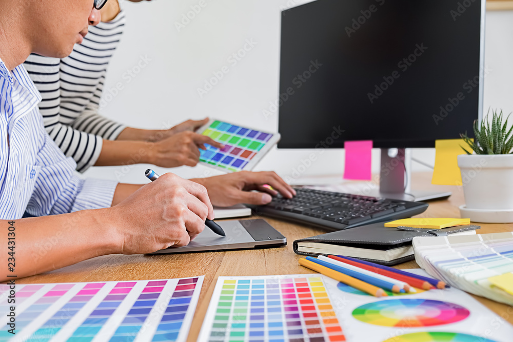 Graphic design with color swatches and tablet on a desk. Graphic ...
