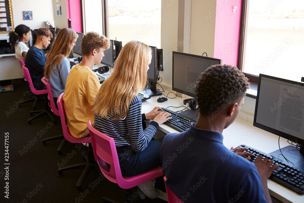 Line Of Teenage High School Students Studying In Computer Class Stock ...